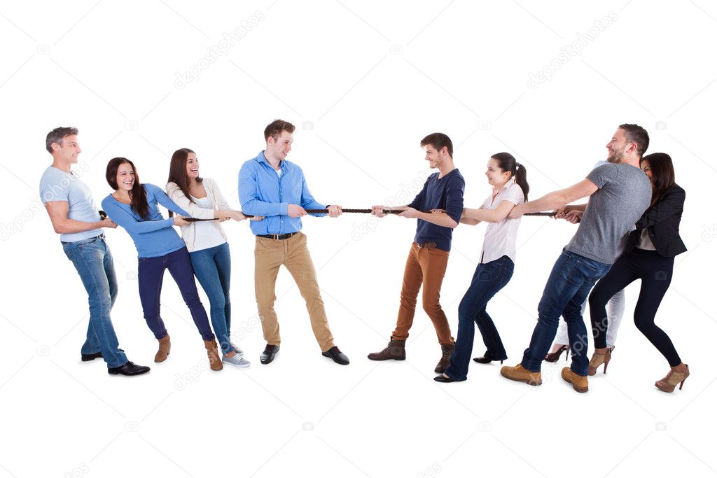 Two opposing teams having a tug of war — Stock Photo © AndreyPopov ...
