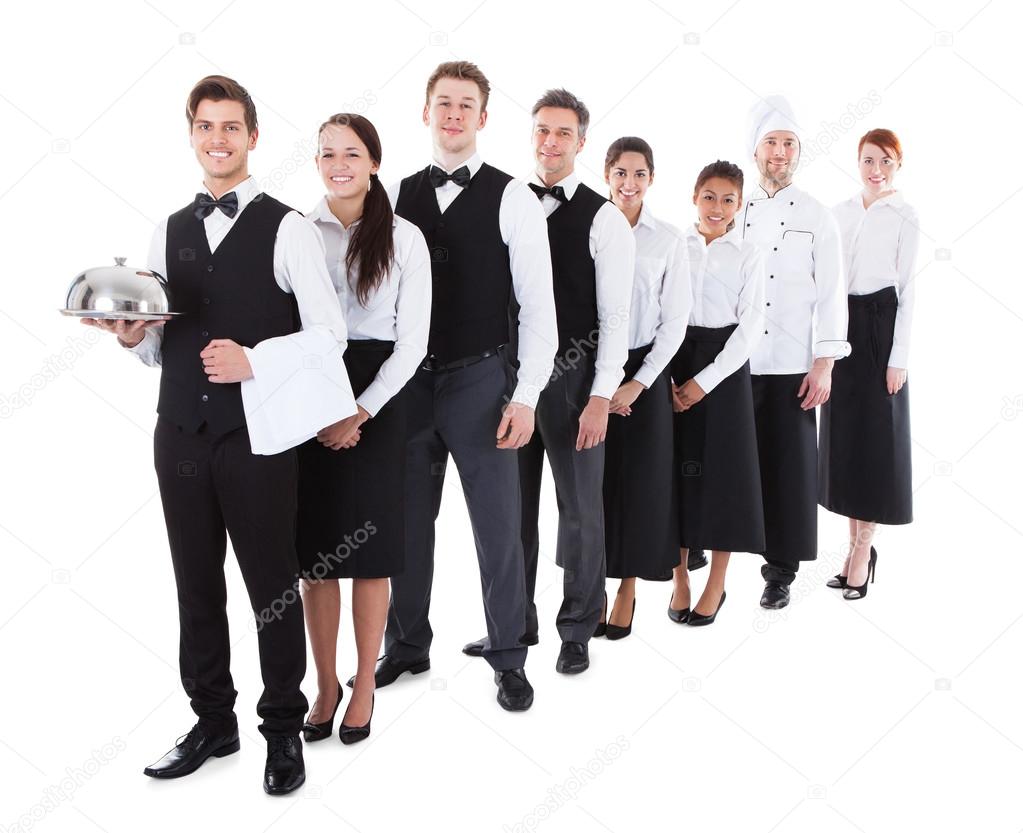 Large group of waiters and waitresses standing in row Stock Photo by ...