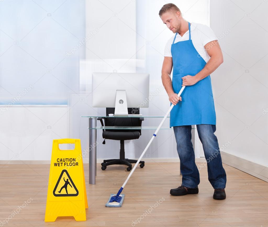 Warning notice as a janitor mops the floor — Stock Photo © AndreyPopov ...