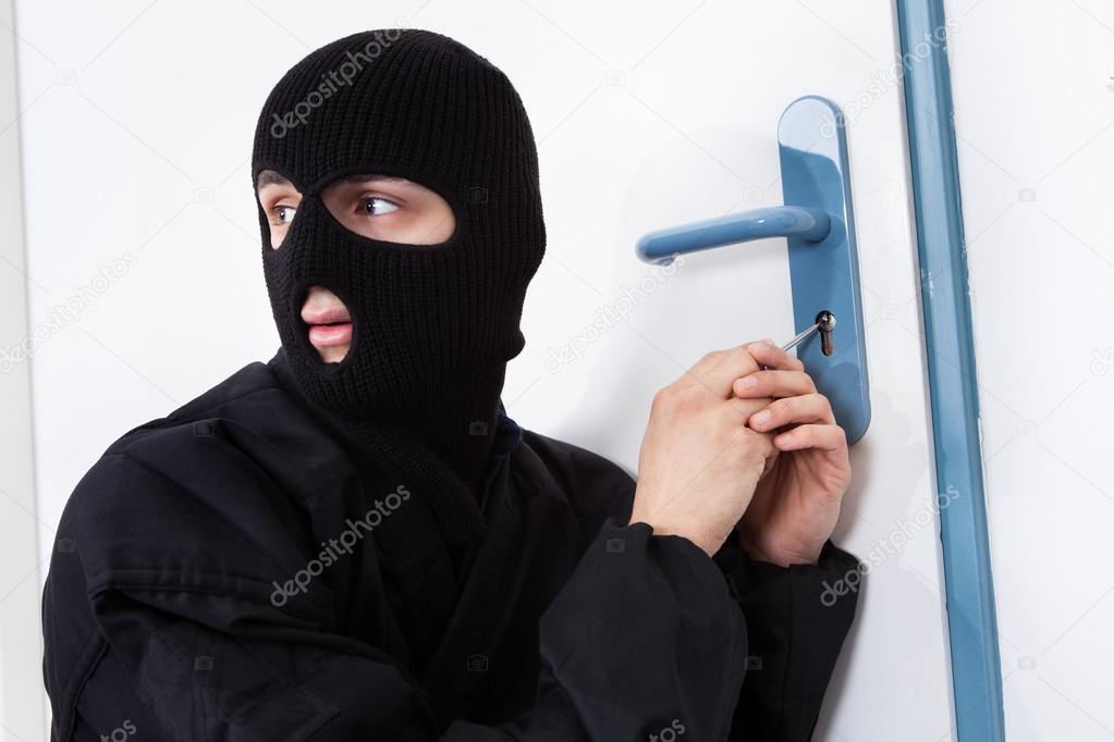 Thief Opening Door With Tool During House Breaking — Stock Photo ...