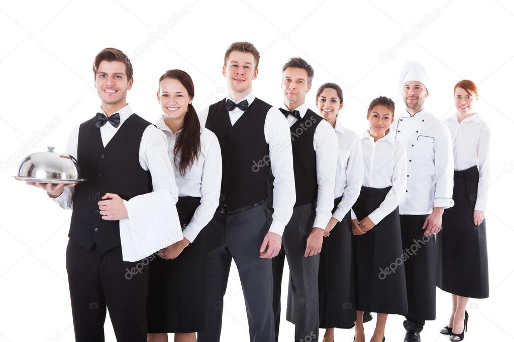 Large group of waiters and waitresses standing in row Stock Photo by ...