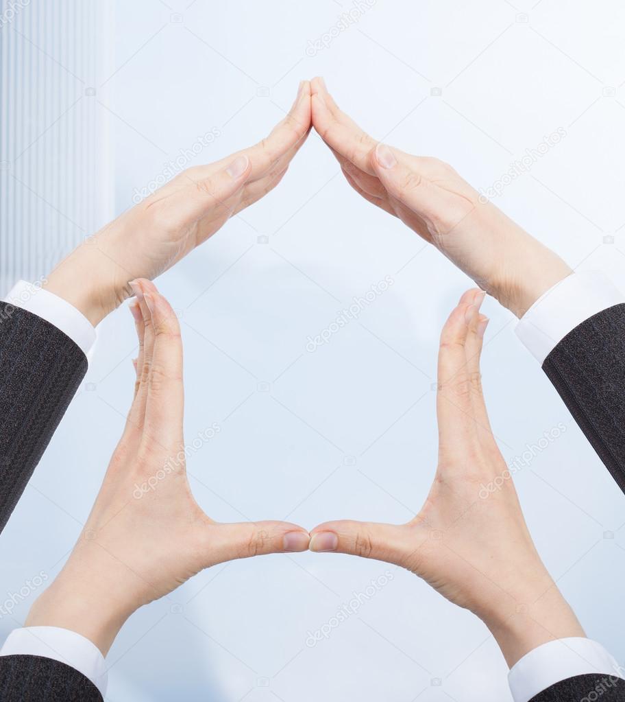 Businesswomen's Hands Forming House Structure Stock Photo by ...