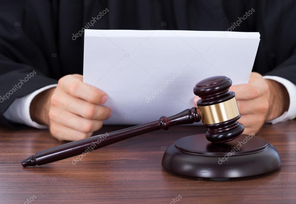 Judge Reading Documents Stock Photo by ©AndreyPopov 48491801