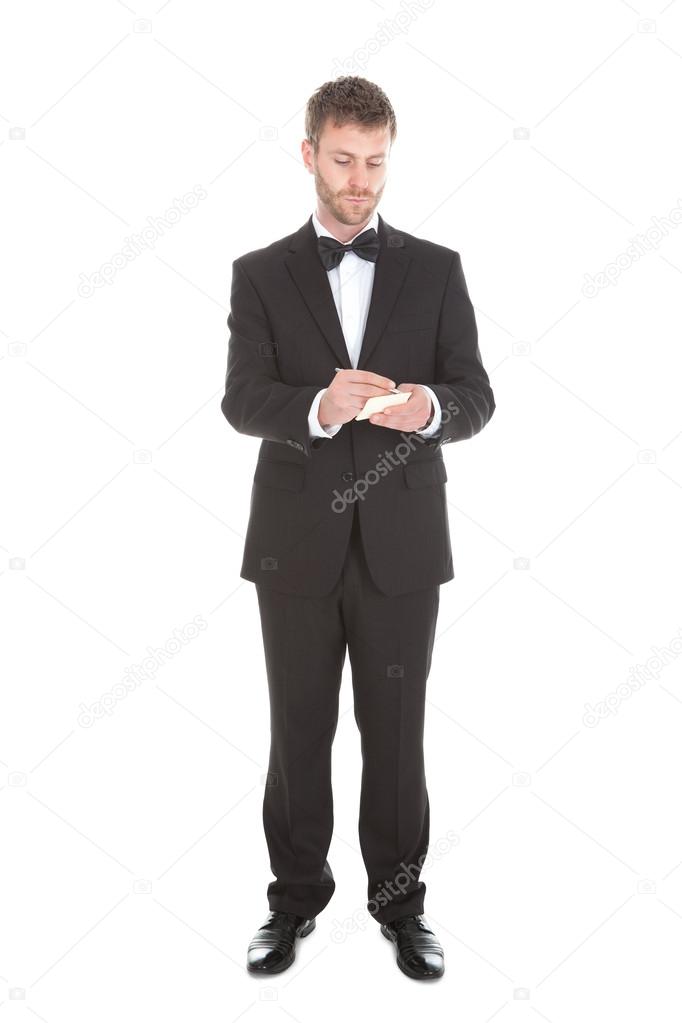 Waiter Writing in Notepad — Stock Photo © AndreyPopov #50348093