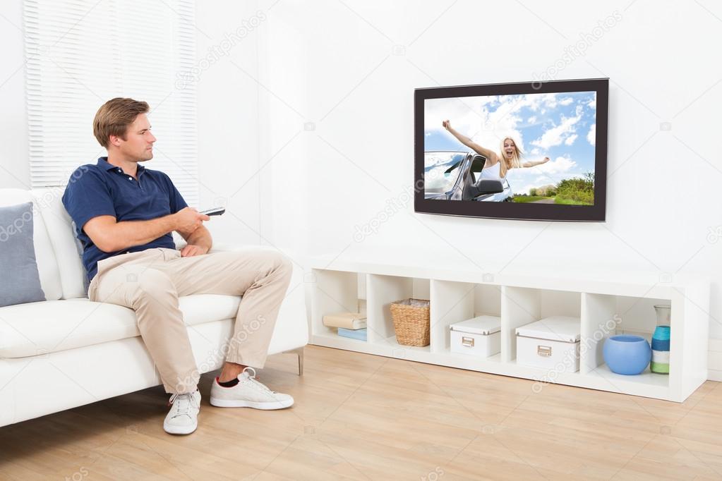homem assistindo tv — Fotografias de Stock © AndreyPopov #50862339