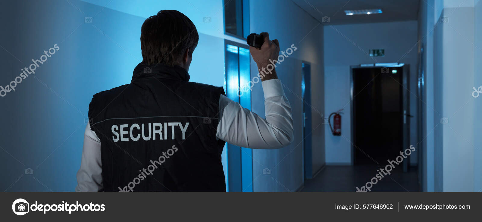 Rear View Security Guard Standing Corridor Building Using Flashlight ...