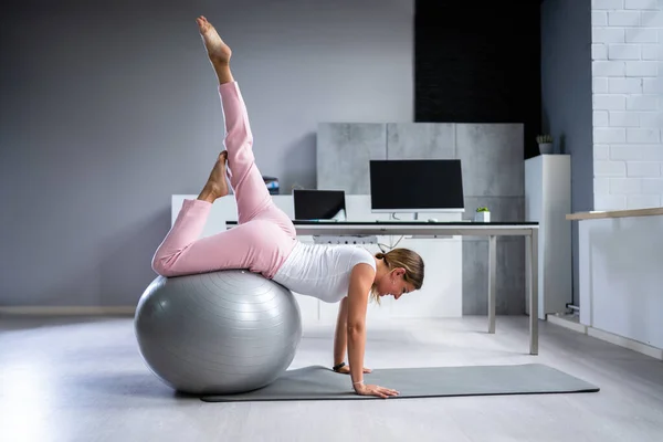 Exercise Workout With Fitness Ball At Office Desk - Stock Image ...