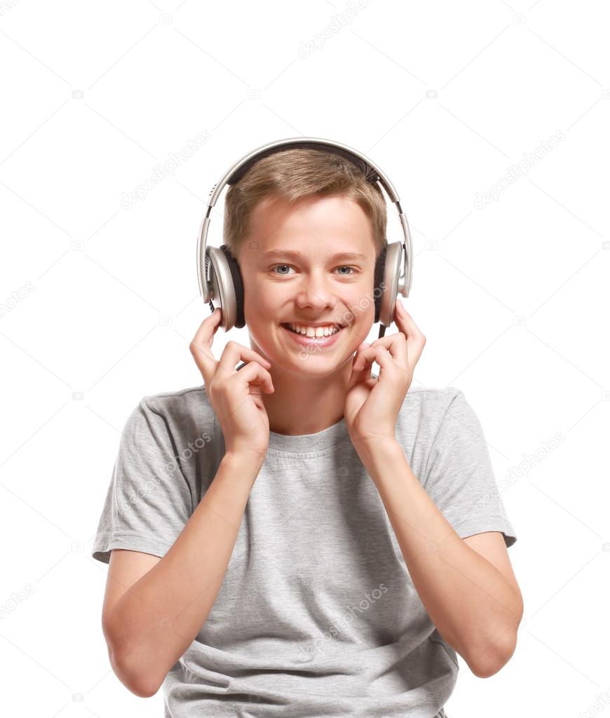Smiling teenage boy listening to music — Stock Photo © ptasha #27695979