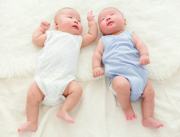 Twins lying on bed and sleeping Stock Photo by ©leungchopan 112525310