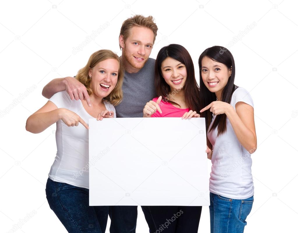 Group of people with diverse ethnicities holding blank sign