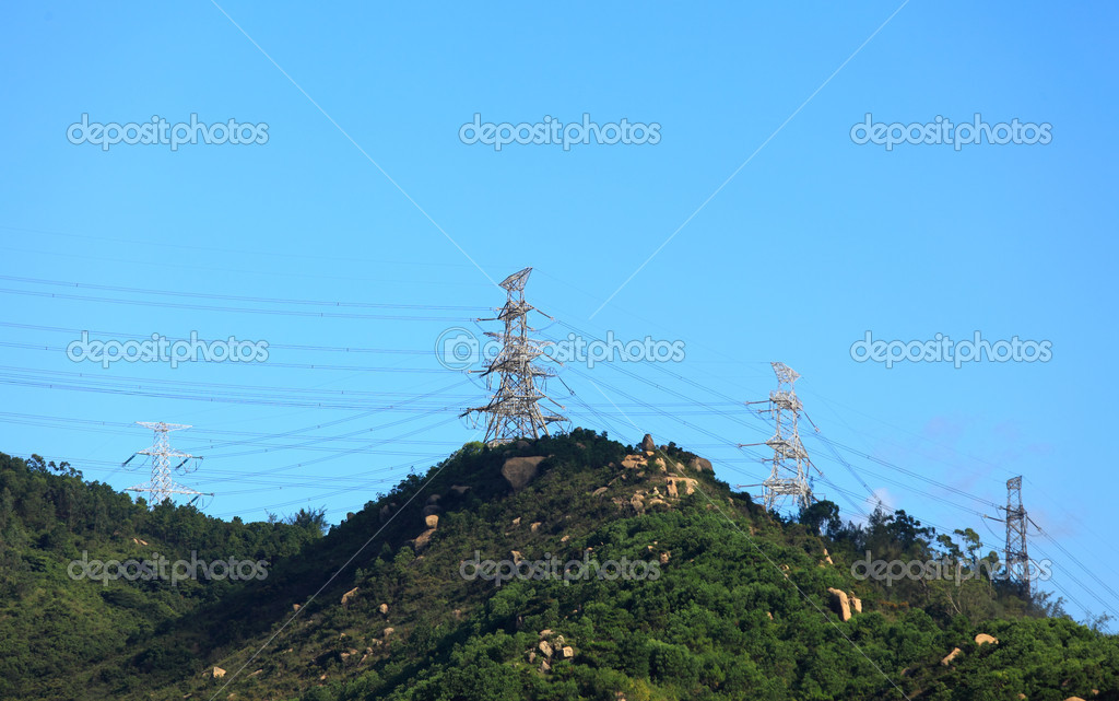 High voltage tower on mountain Stock Photo by ©leungchopan 47478245