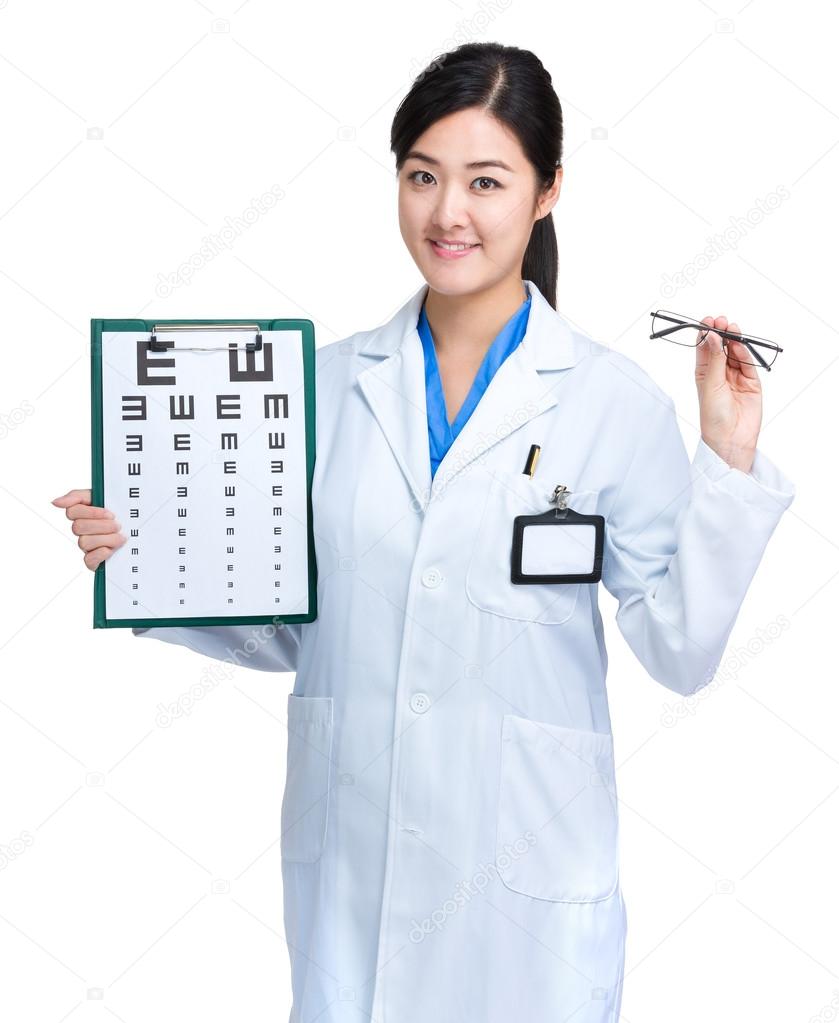 Optician doctor with eye chart and glasses — Stock Photo © leungchopan ...