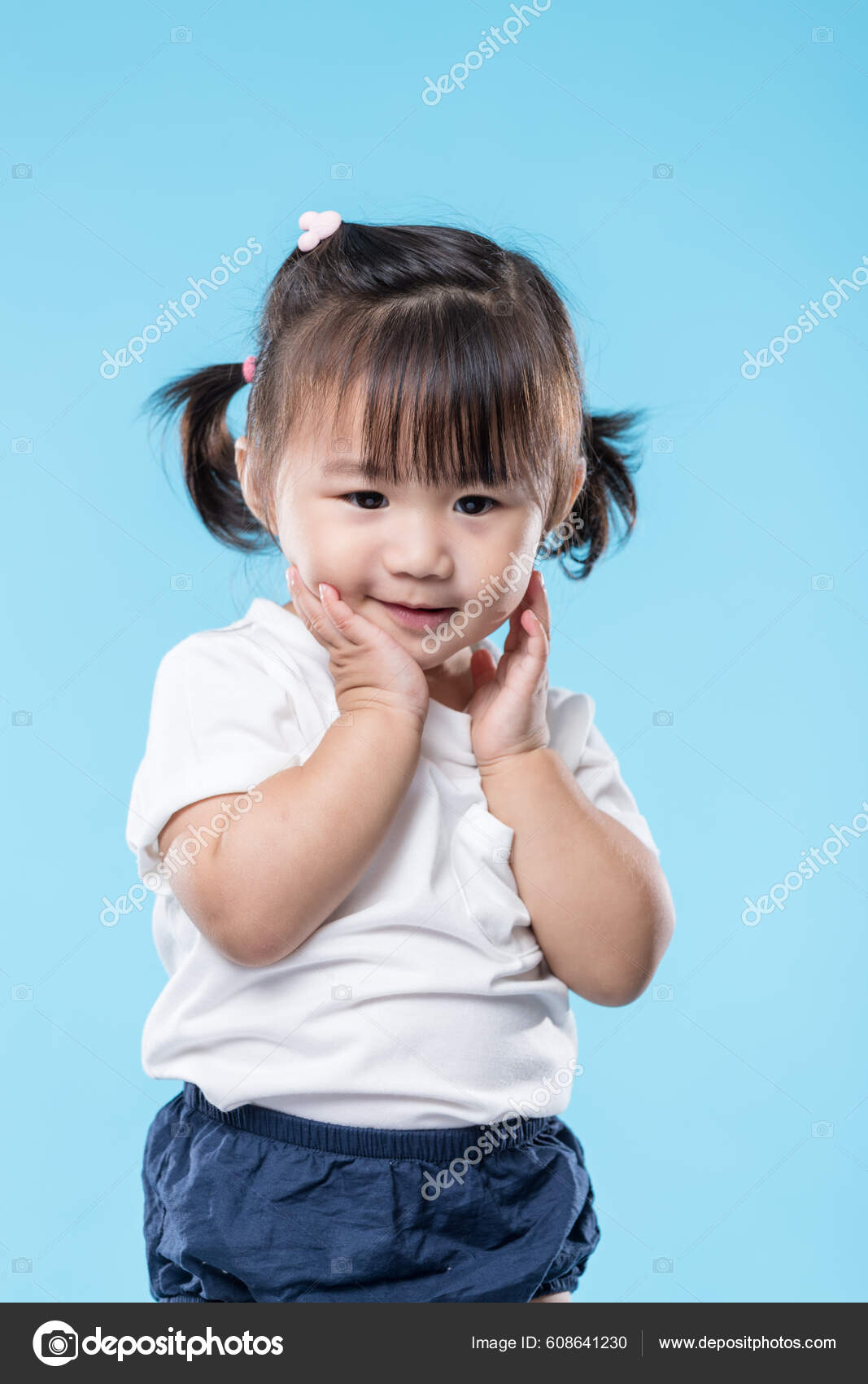 Little Girl Touch Her Face — Stock Photo © leungchopan #608641230