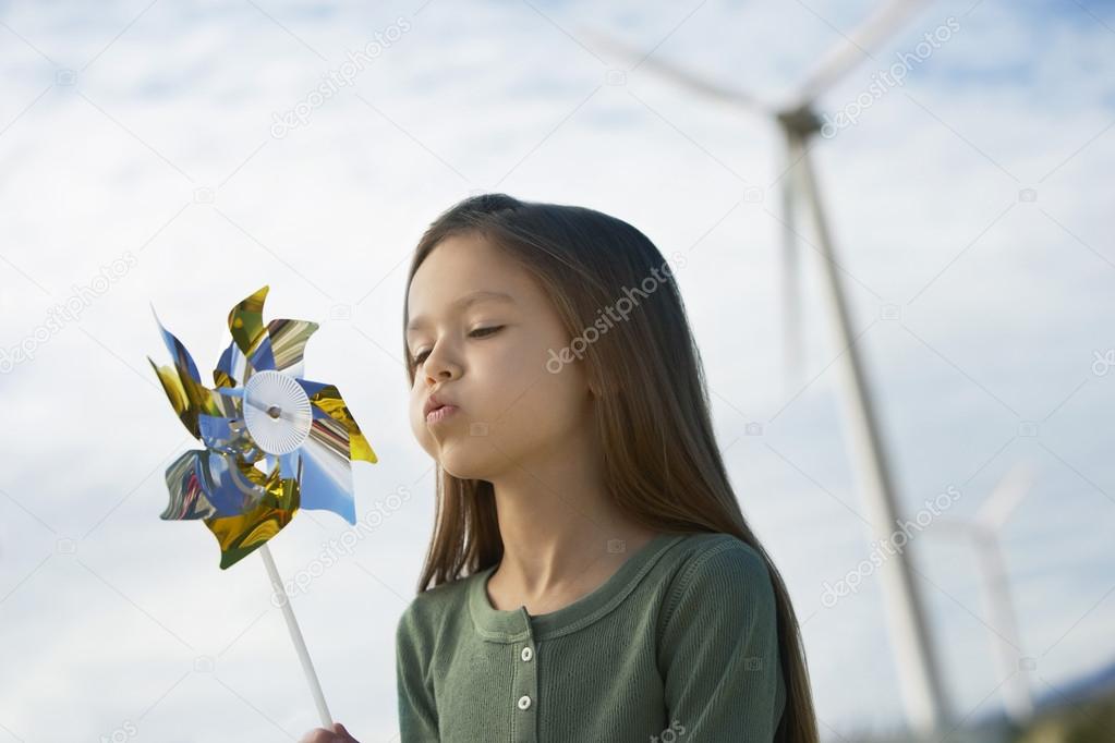 Girl blowing toy windmill ⬇ Stock Photo, Image by © londondeposit #21799299 Girl blowing toy windmill ⬇ Stock Photo, Image by © londondeposit #21799299