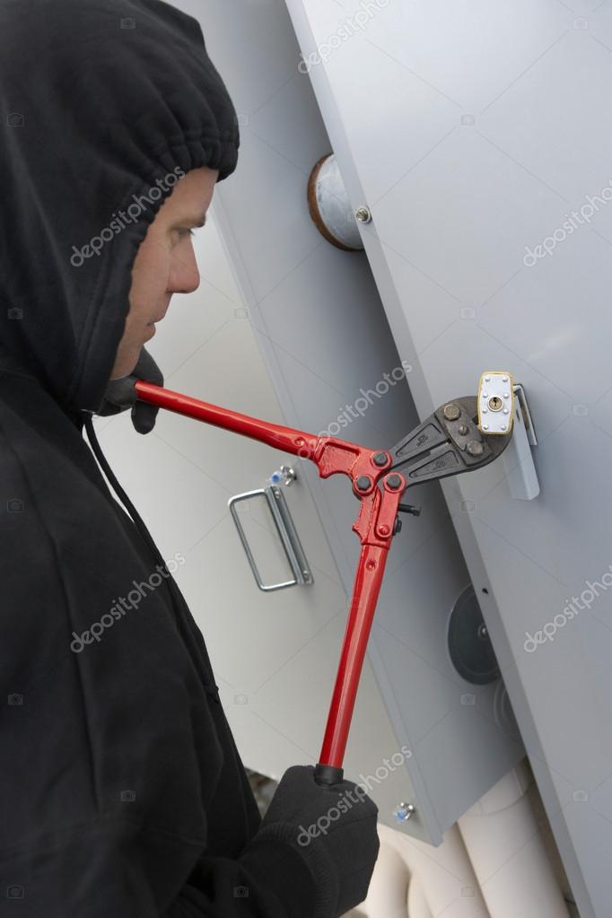 Thief Cutting Lock Stock Photo by ©londondeposit 21799869