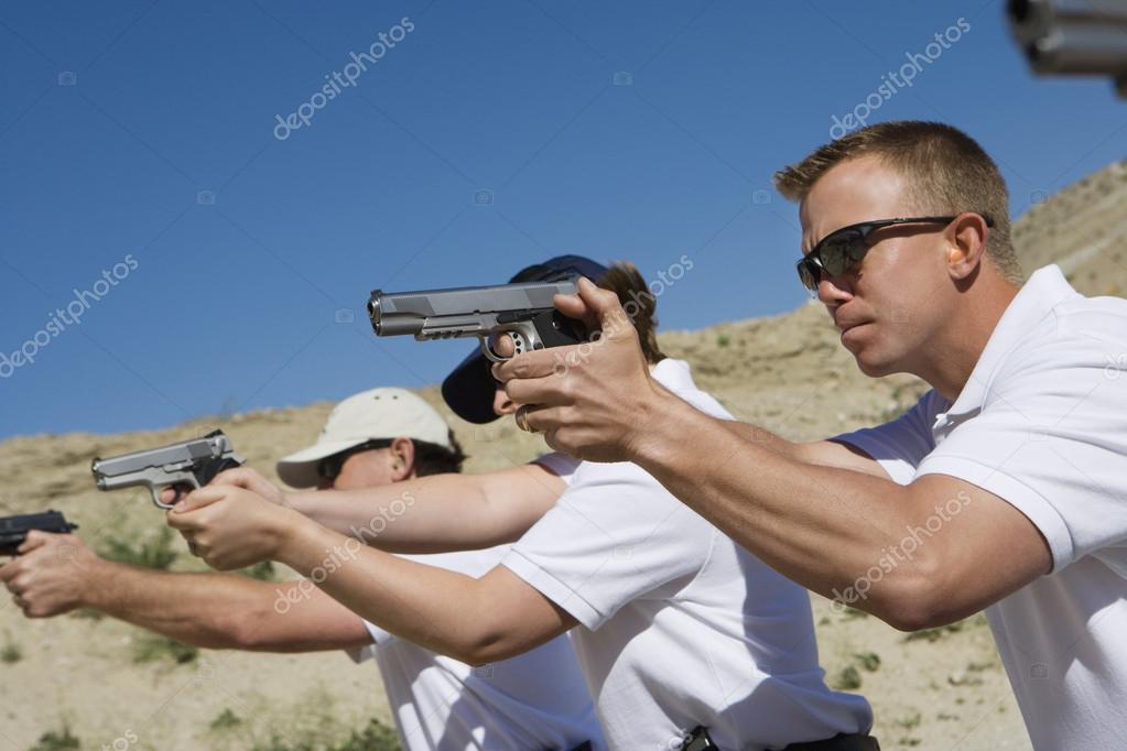 Aiming Hand Guns At Firing Range — Stock Photo © londondeposit #21801819