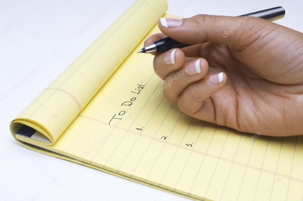Hand Writing List Of Tasks To Do On Notepad Stock Photo by ...