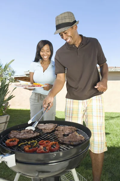 Happy Couple Barbequing - Stock Image - Everypixel