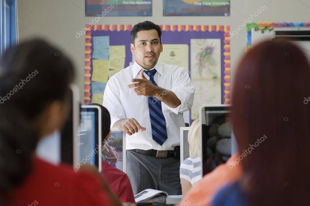 High School Teacher Teaching In Class — Stock Photo © londondeposit ...