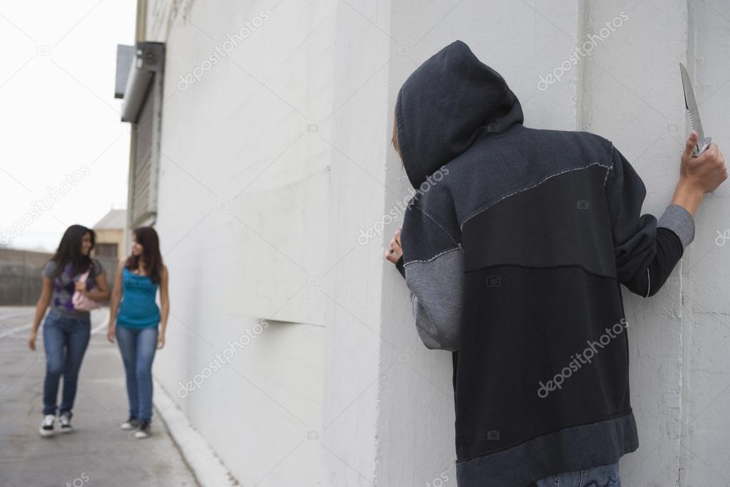 Robber With Knife Hiding Behind Corner And Waiting For Two Girls ...