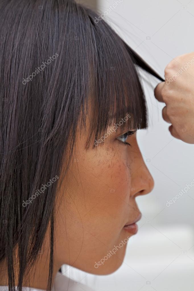 Side view of Asian woman getting a new haircut Stock Photo by ...