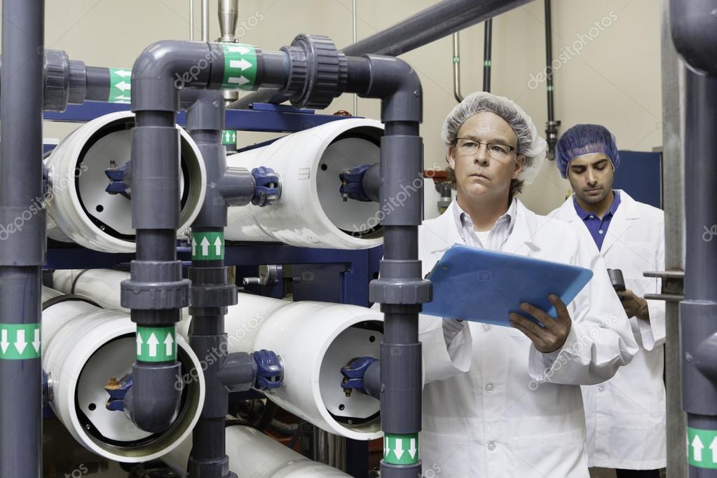 Factory workers inspecting — Stock Photo © londondeposit #21874753