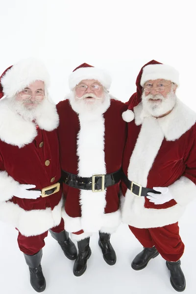 Rear View Of Four Men Dressed In Santa Claus Outfits Stock Photo by ...