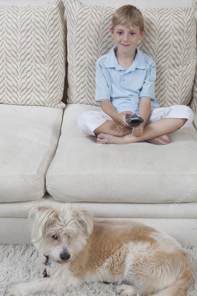 Boy Watching TV With Dog Stock Photo by ©londondeposit 21929583