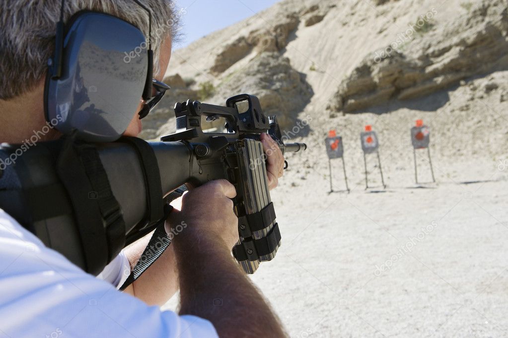 Man Aiming Machine Gun At Firing Range — Stock Photo © londondeposit ...
