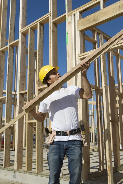 Construction worker working on building window Stock Photo by ...