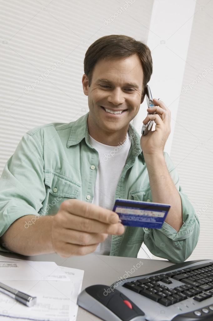 Man Using Credit Card — Stock Photo © londondeposit #33803577 Man Using Credit Card — Stock Photo © londondeposit #33803577