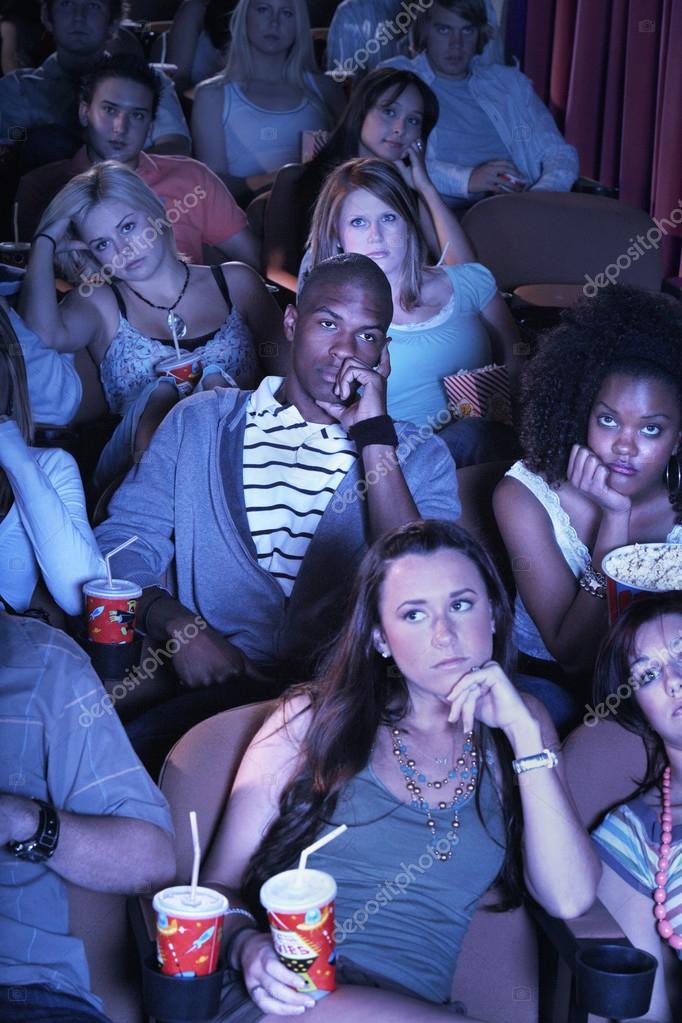 People Watching Boring Movie — Stock Photo © londondeposit #33807859