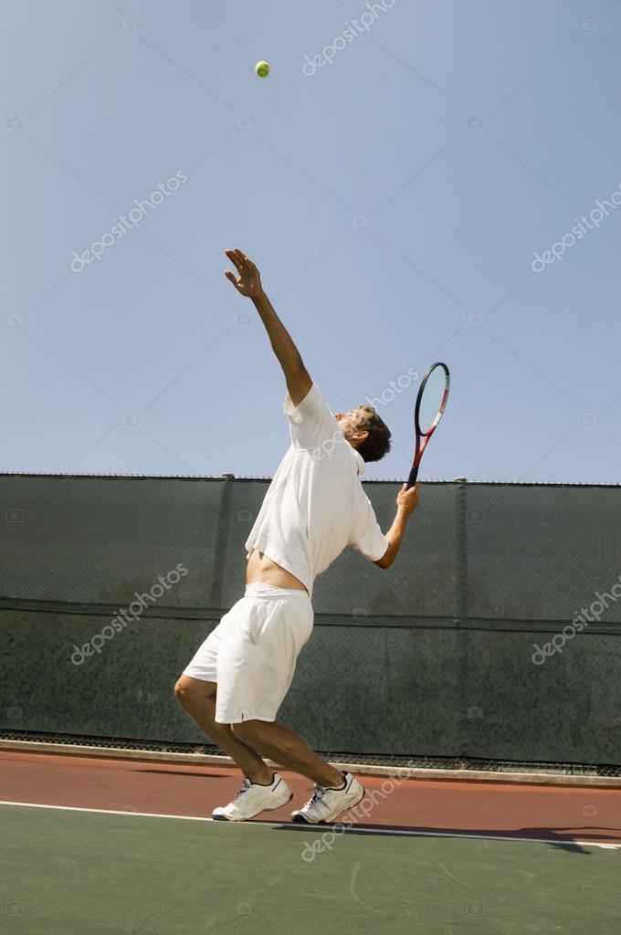 Man Serving Tennis Ball — Stock Photo © londondeposit #33809595