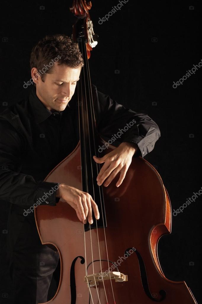 Man Playing Double Bass Stock Photo by ©londondeposit 33825469