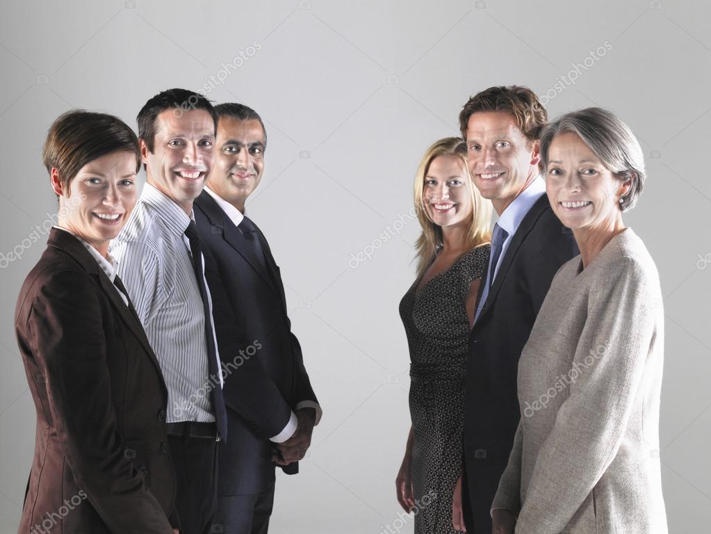 Two groups of businesspeople in two rows — Stock Photo © londondeposit ...