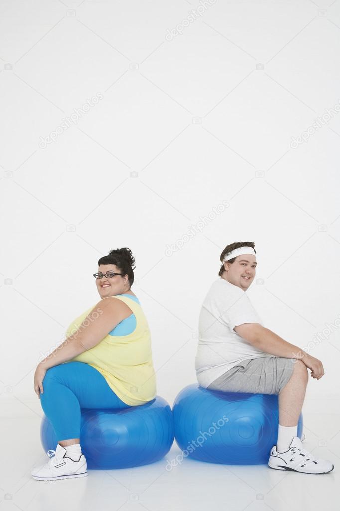 Man and woman sitting back to back — Stock Photo © londondeposit #33833175