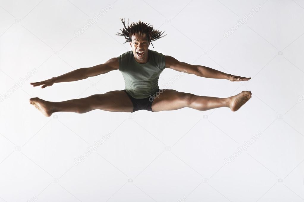 Ballet dancer leaping in mid-air — Stock Photo © londondeposit #33833711