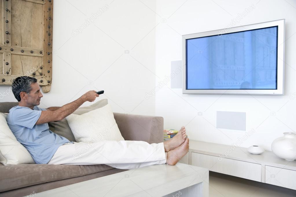 Man Watching TV Stock Photo by ©londondeposit 33833903