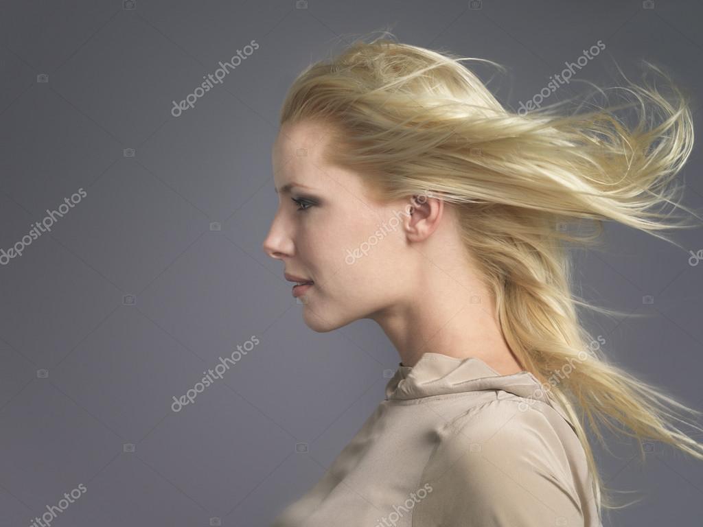 Woman Facing the Wind Stock Photo by ©londondeposit 33839549