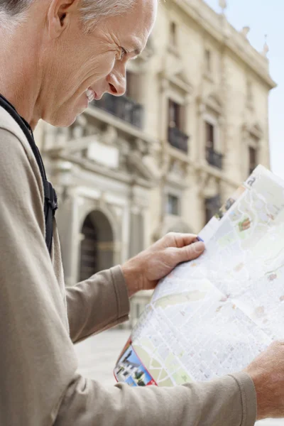 Tourist Reading Map - Stock Image - Everypixel