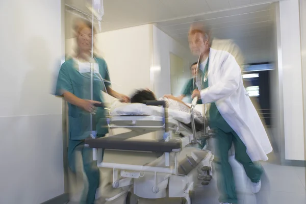 Doctors running Patient on gurney - Stock Image - Everypixel