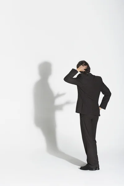Businessman arguing with own shadow Stock Photo by ©londondeposit 33827943