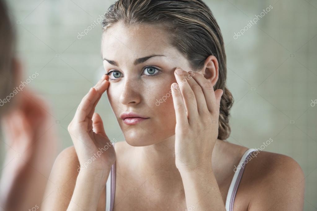Woman Applying Facial Cream — Stock Photo © londondeposit #33840189 Woman Applying Facial Cream — Stock Photo © londondeposit #33840189