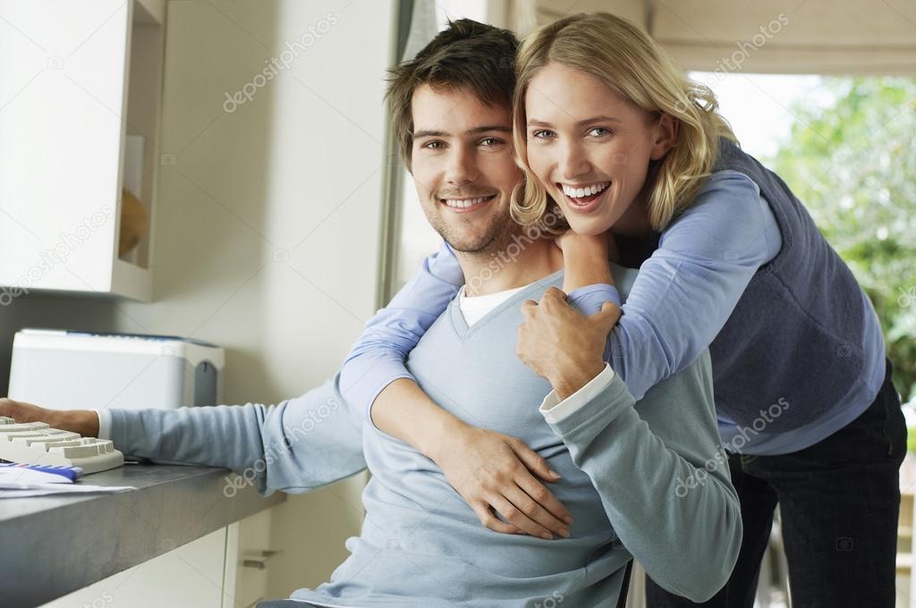 Happy Couple using computer — Stock Photo © londondeposit #33849781