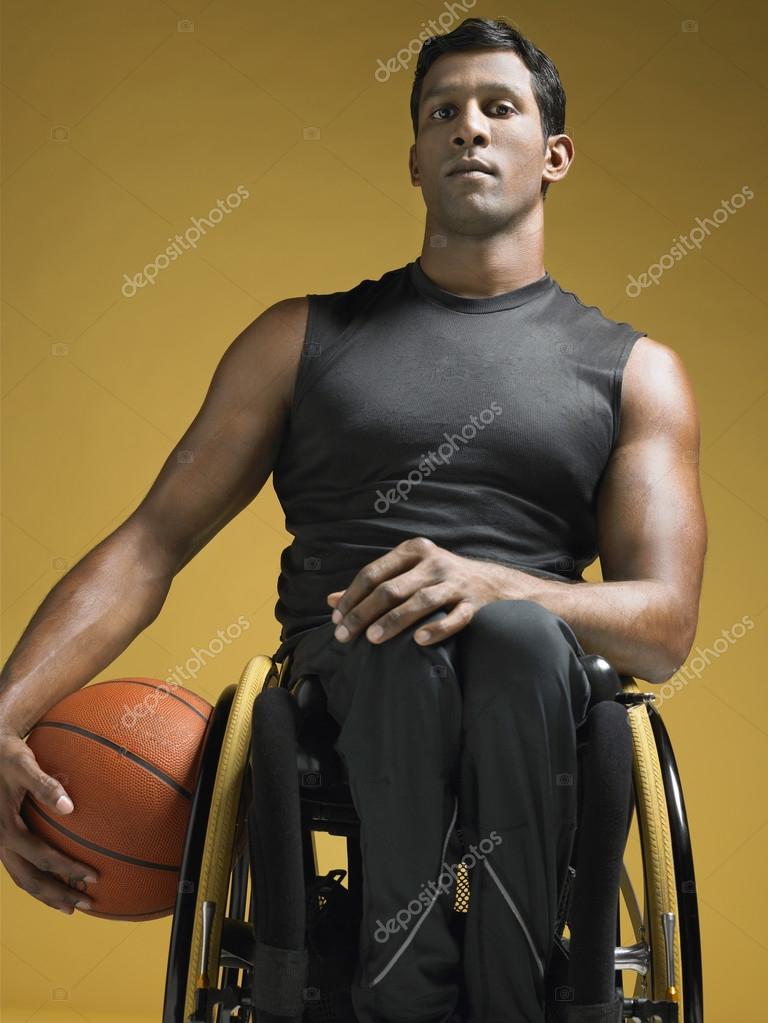 Paraplegic athlete holding basketball Stock Photo by ©londondeposit ...