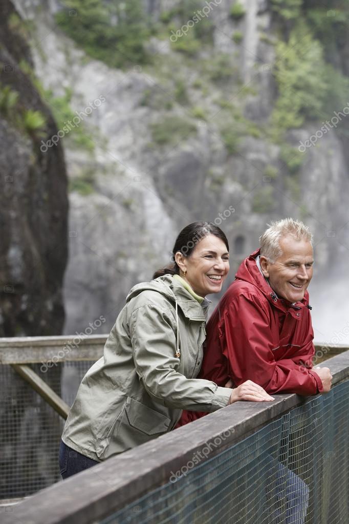 Man and woman on railing — Stock Photo © londondeposit #33876101