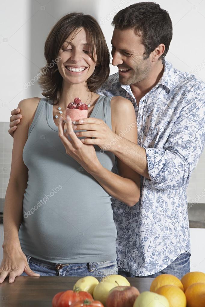 Man Giving Woman Raspberry Cake — Stock Photo © londondeposit #33879627