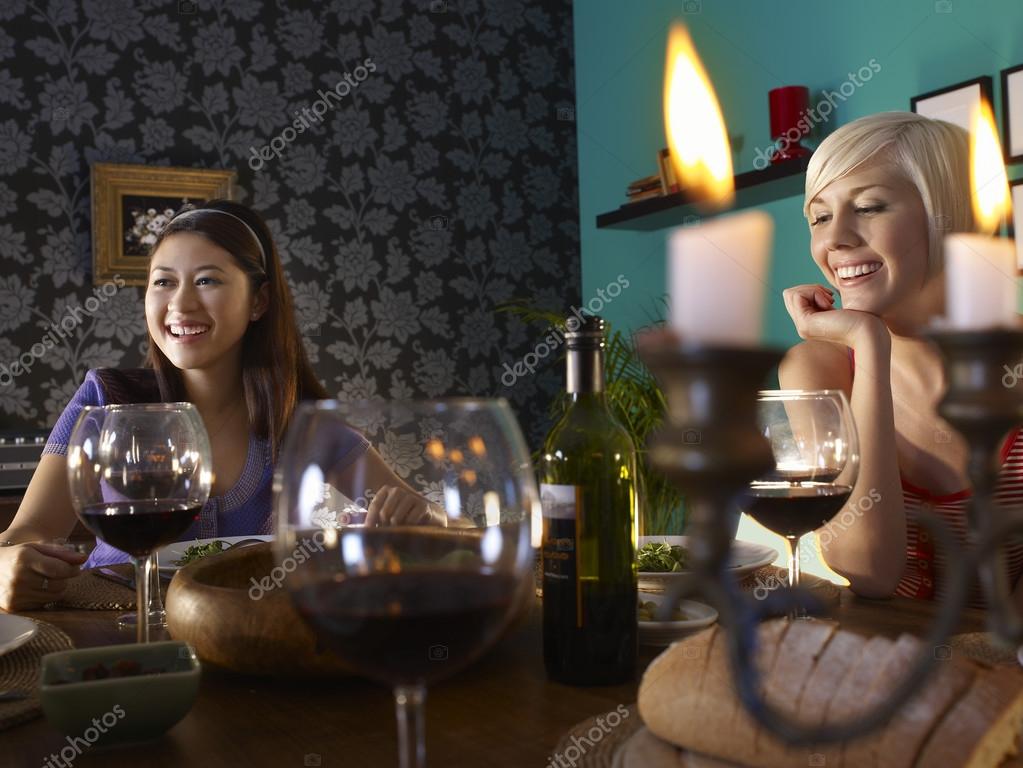 Women sitting at dining table — Stock Photo © londondeposit #33884243