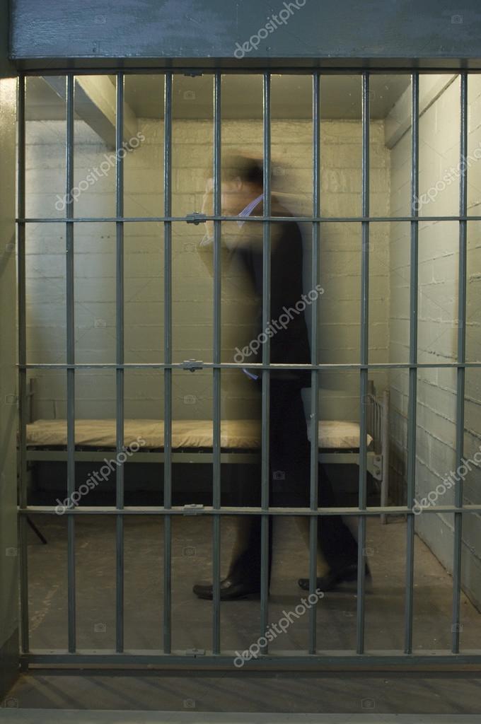 Man in prison cell Stock Photo by ©londondeposit 33891885