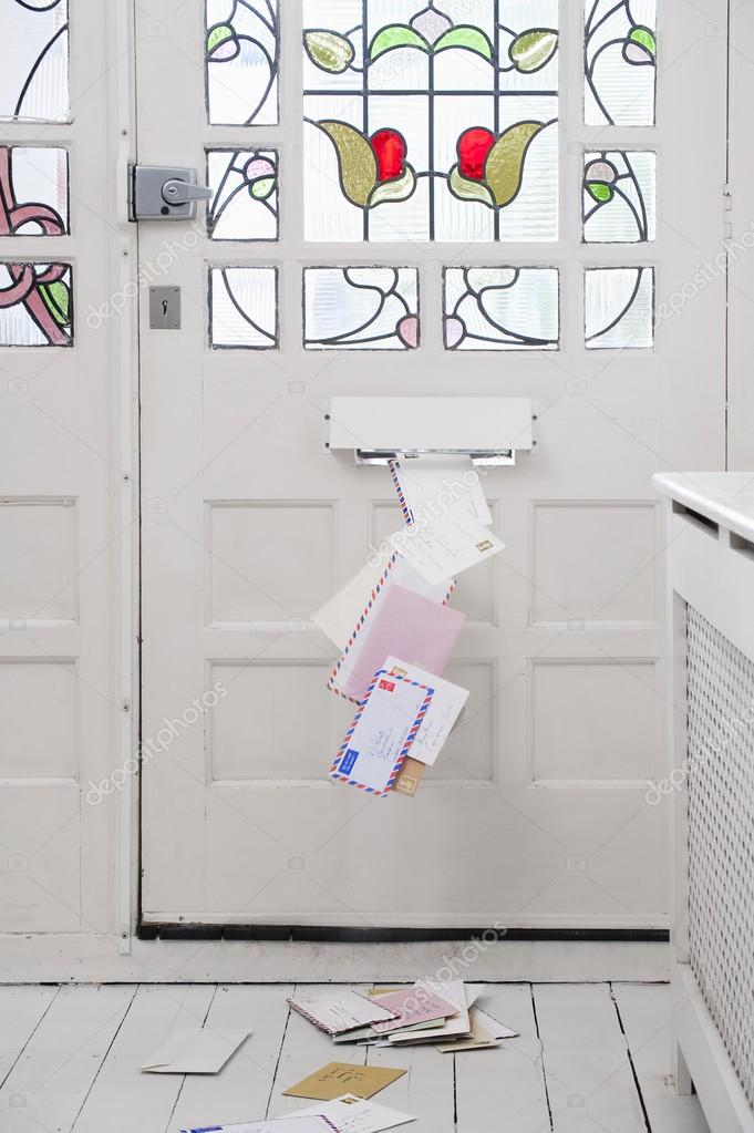 Letters in front door — Stock Photo © londondeposit #33982847